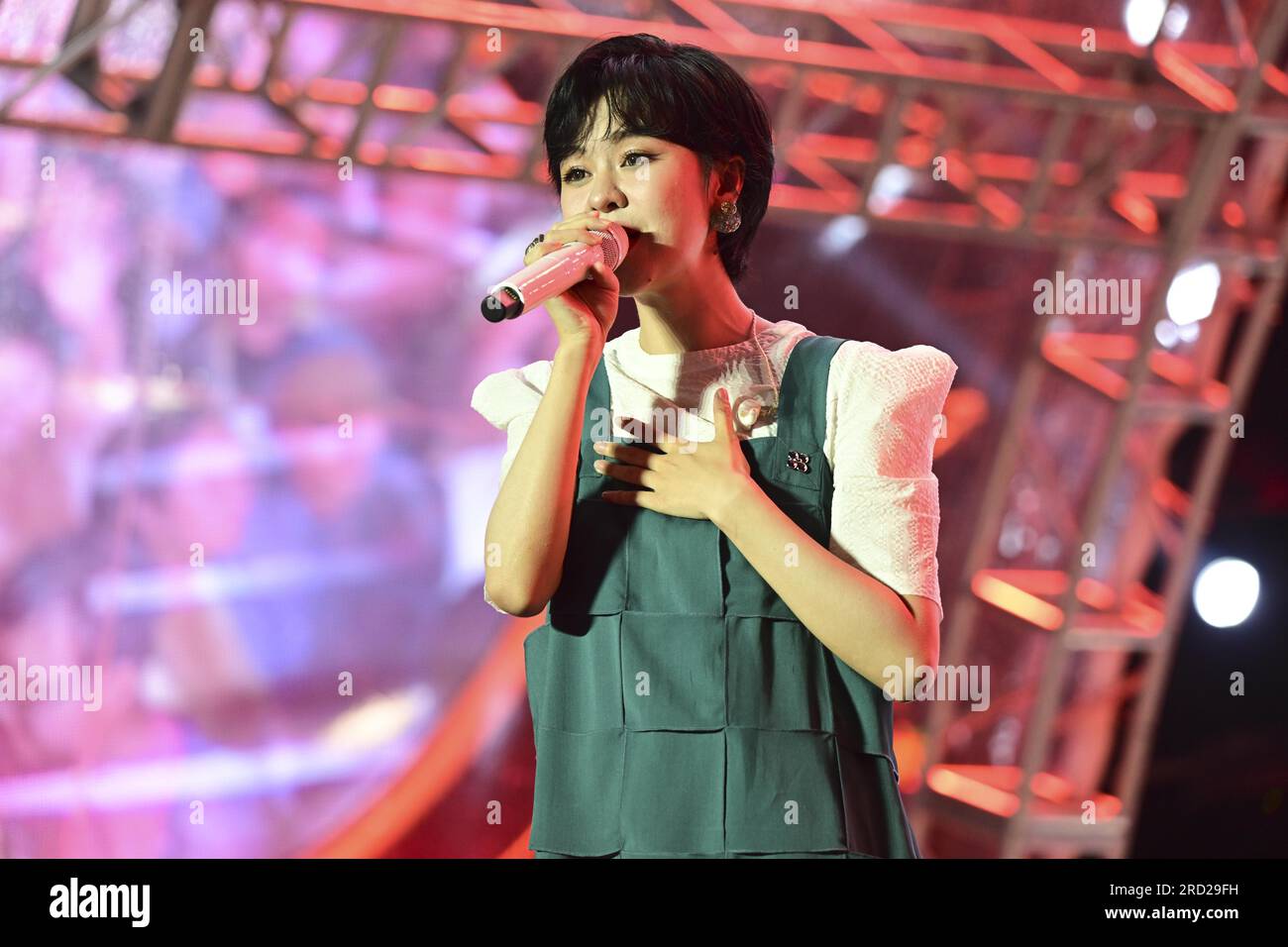 Chinese singer Yisa Yu performs at a beer music festival in Suzhou City ...
