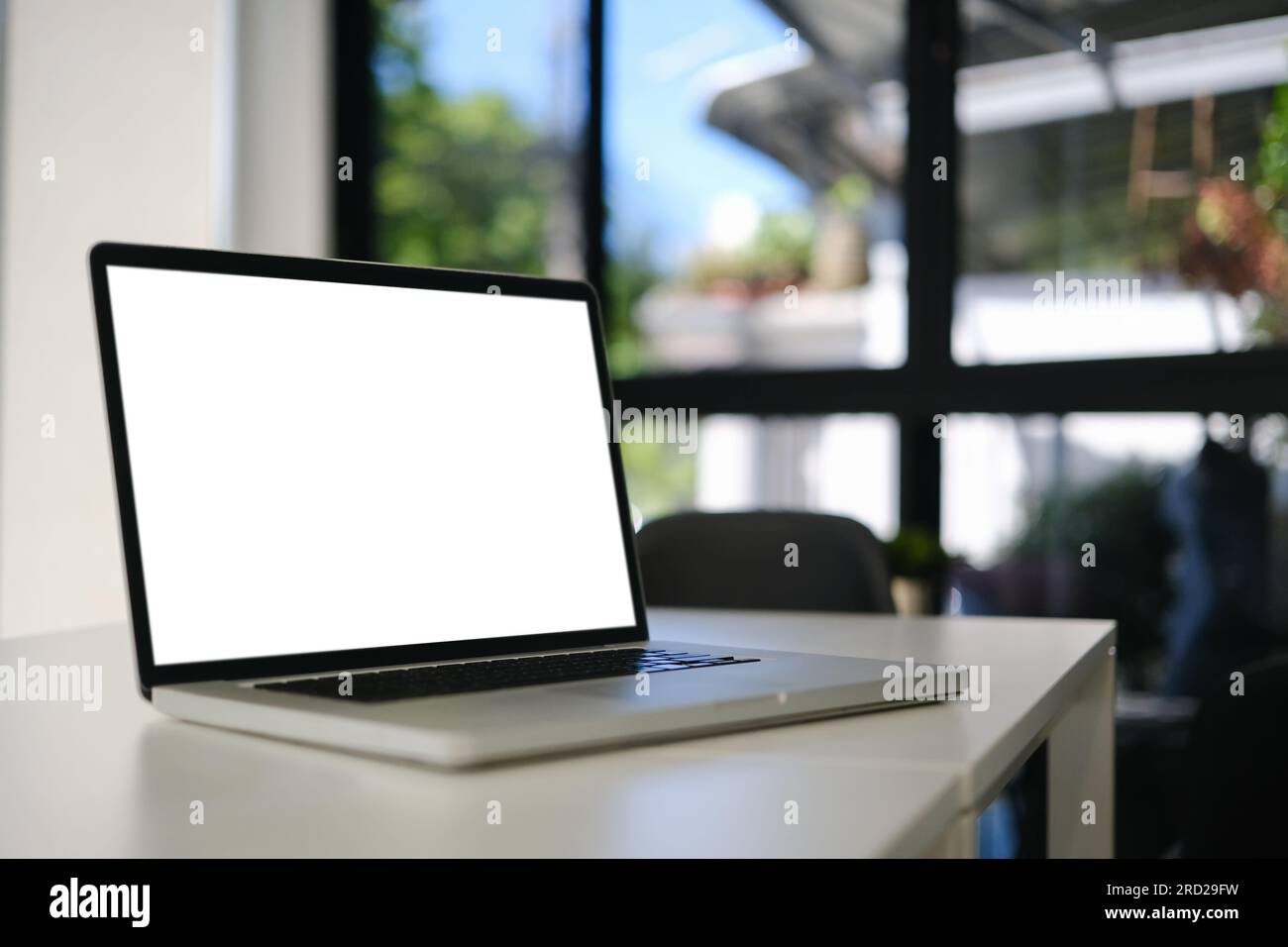 Closeup laptop computer with white empty screen on office desk. Blank ...