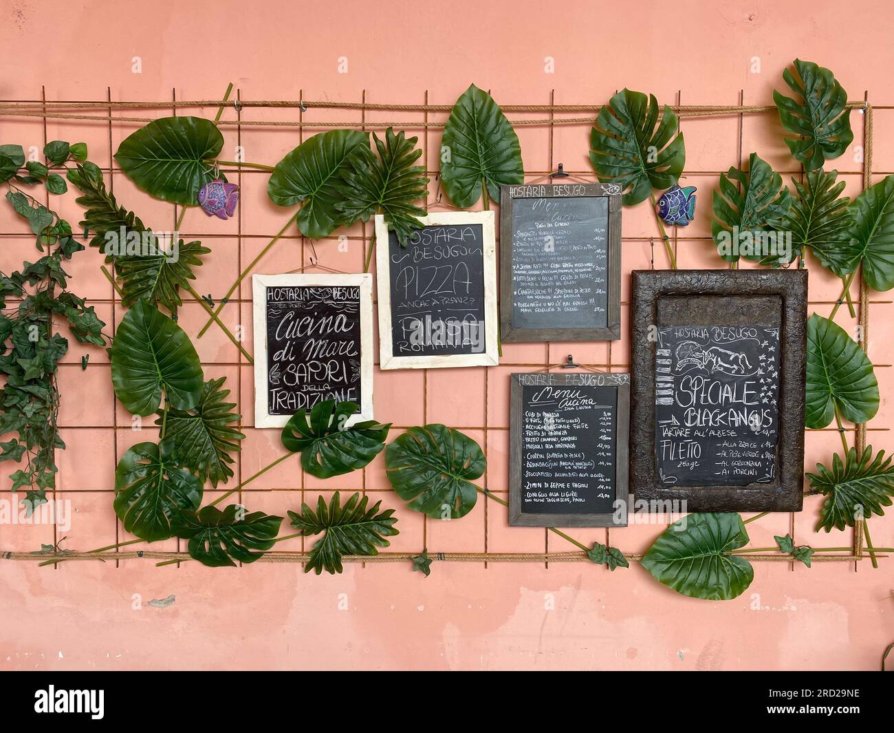 Menu cards on wall Stock Photo - Alamy