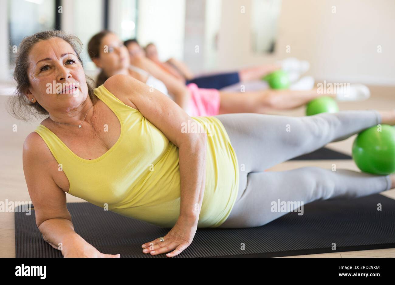 Group of women exercising with bender ball Stock Photo - Alamy