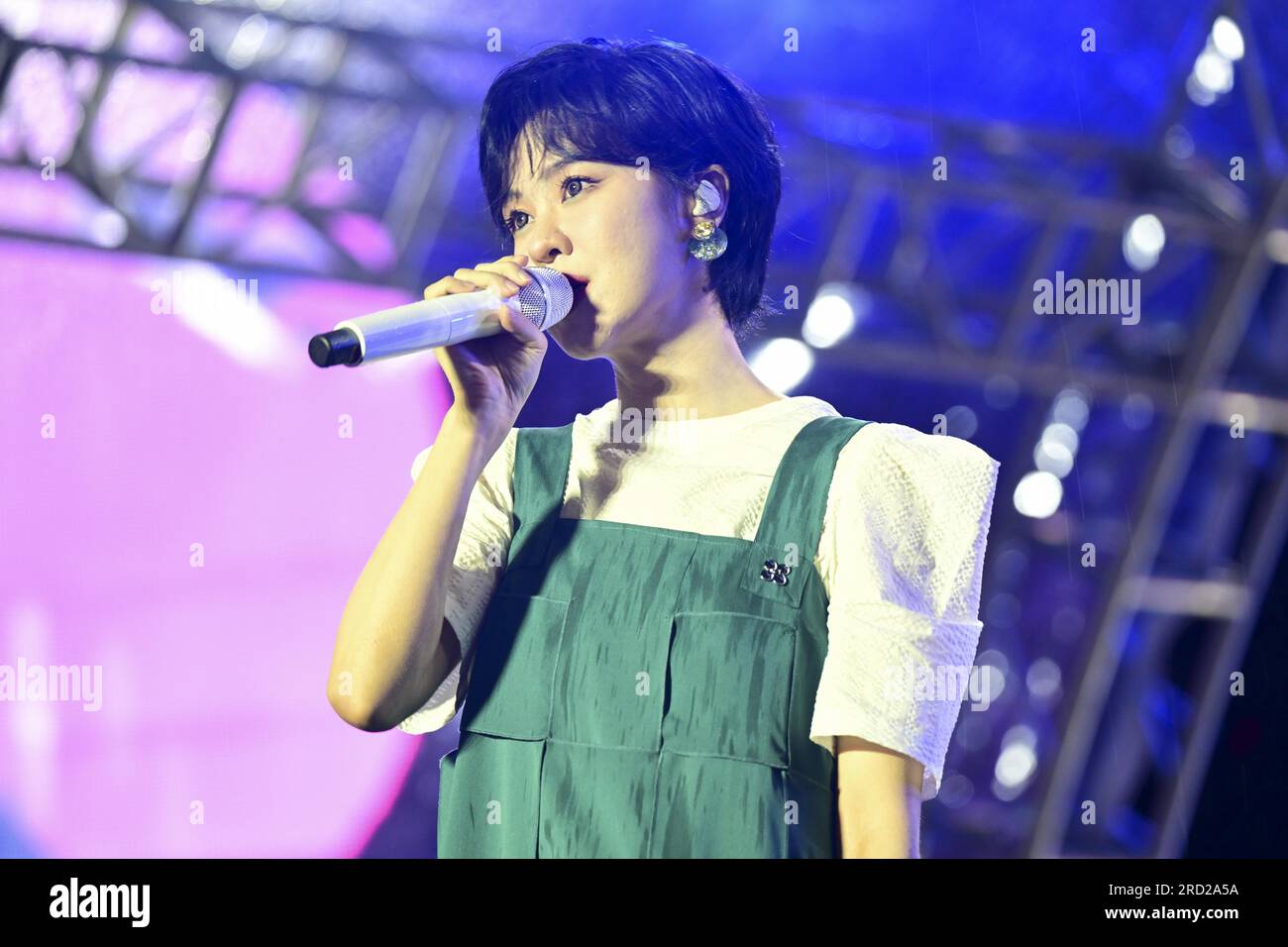 Chinese singer Yisa Yu performs at a beer music festival in Suzhou City ...