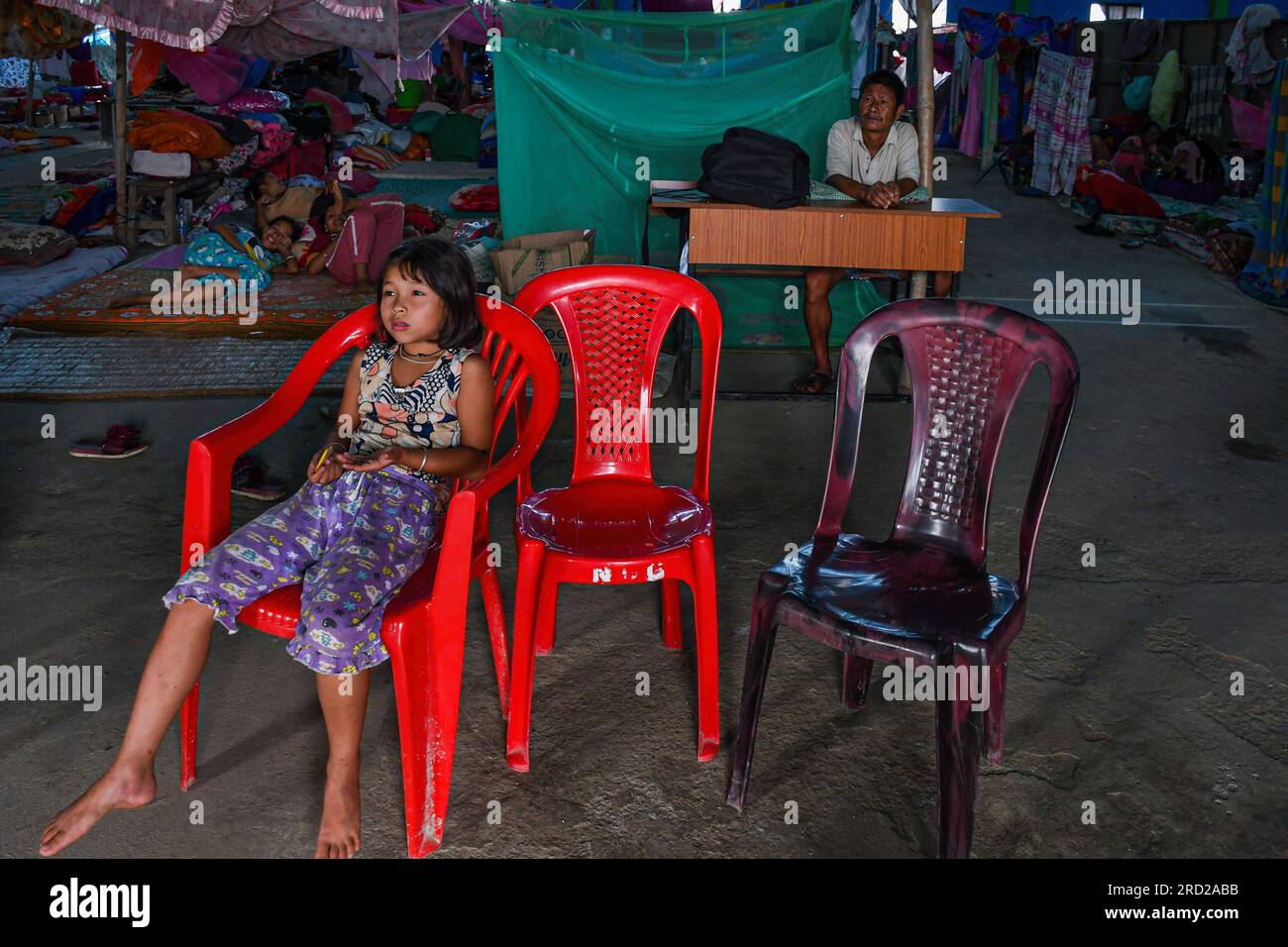 Imphal, India. 15th July, 2023. A girl watches tv at a relief camp. The ...