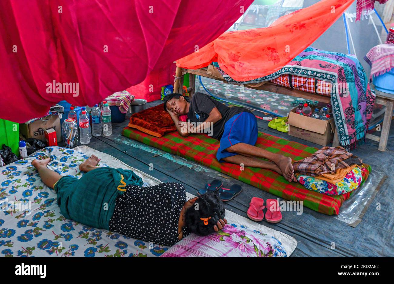 Women take an afternoon nap at a relief camp. The genesis of the ...