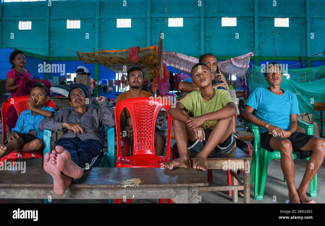 People watch tv at a relief camp in Imphal. The genesis of the conflict ...