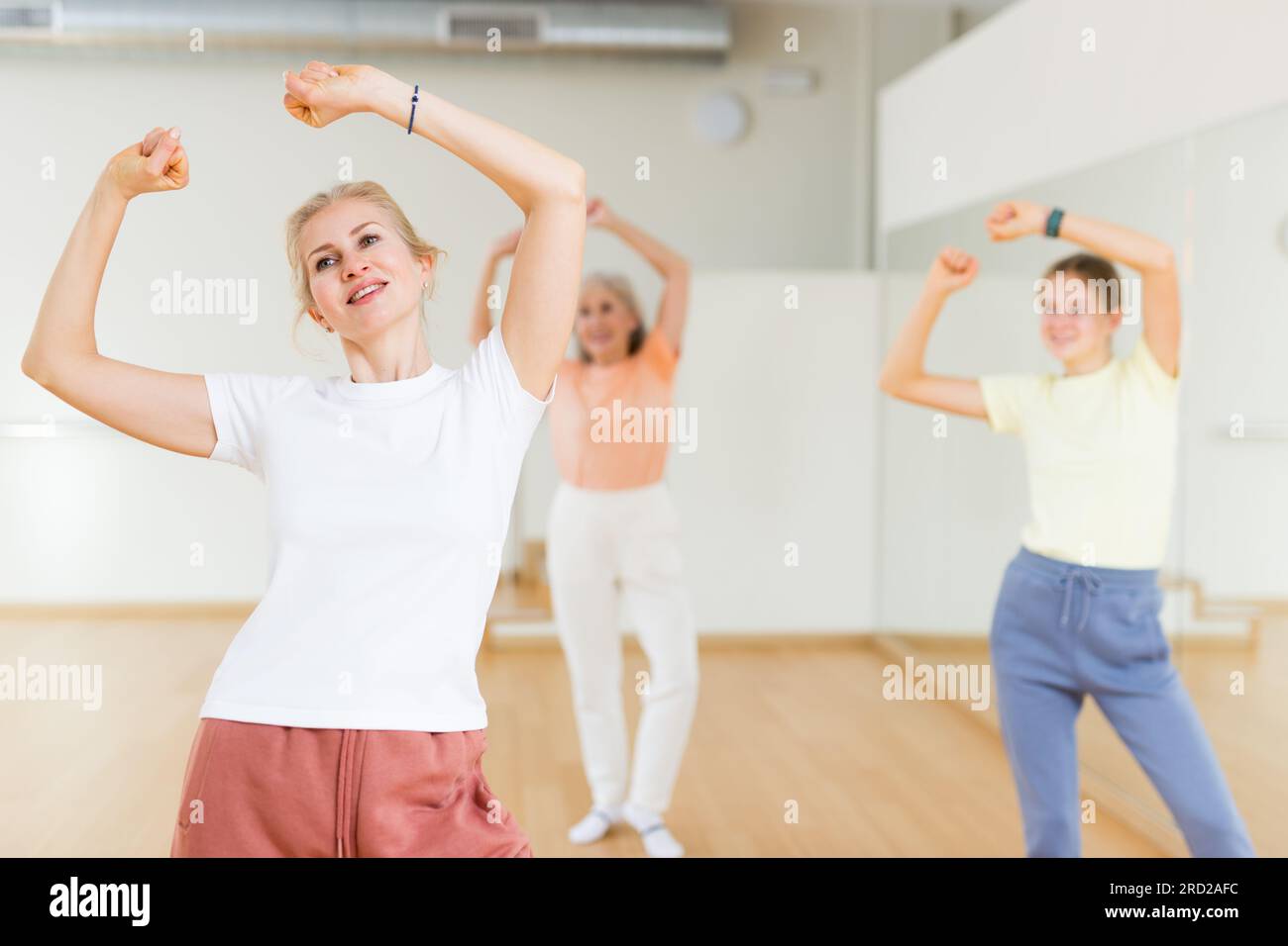Modern active females dancing excited posing in studio Stock Photo - Alamy