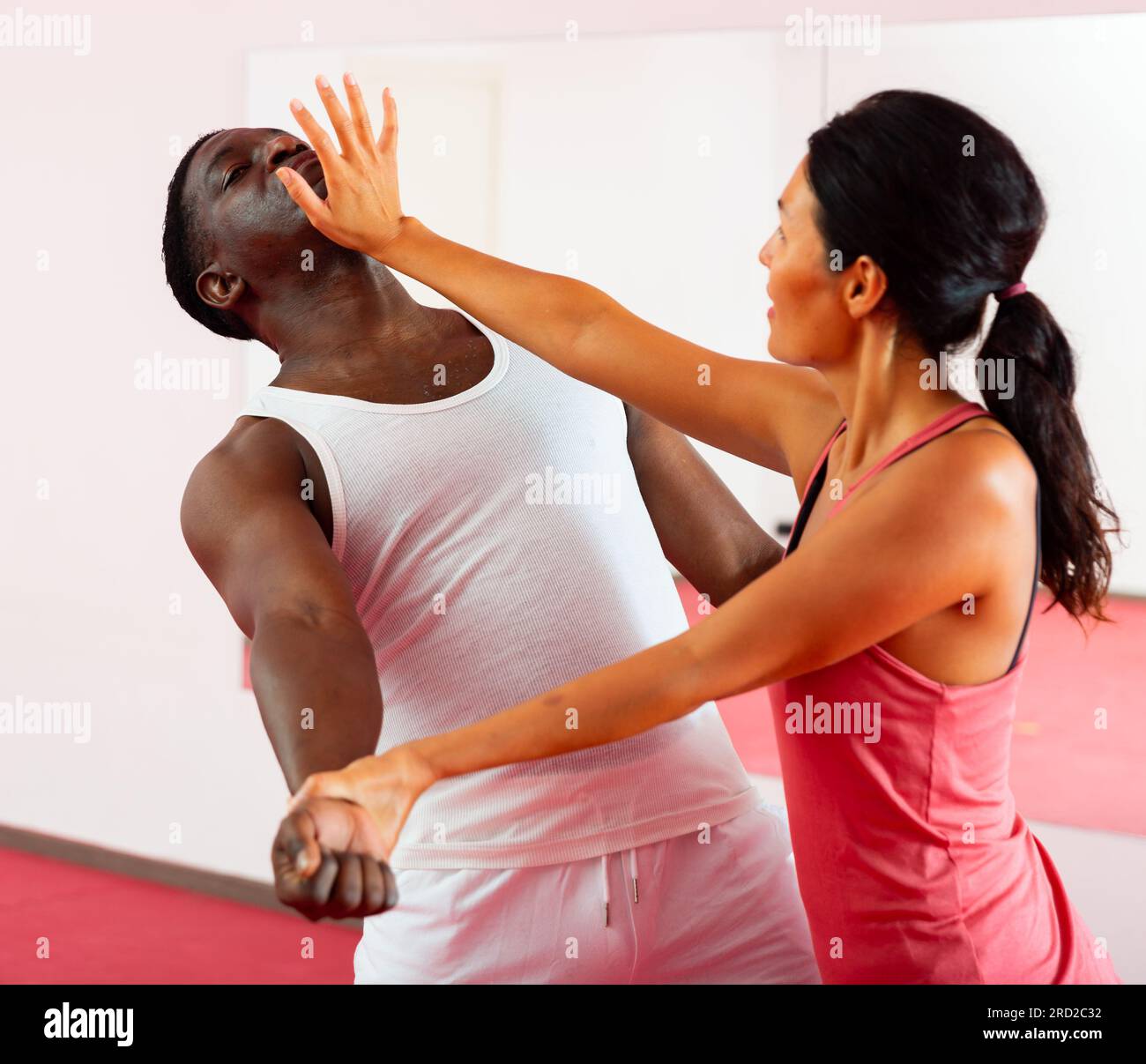 Woman doing strength techniques in self defense training Stock Photo ...