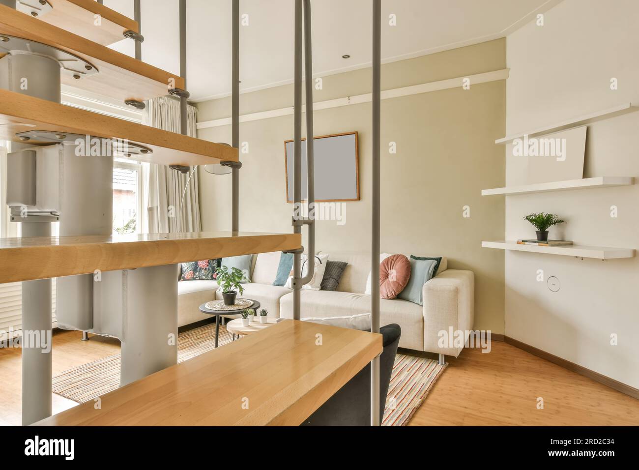 a living room with wood flooring and white walls, including an open ...