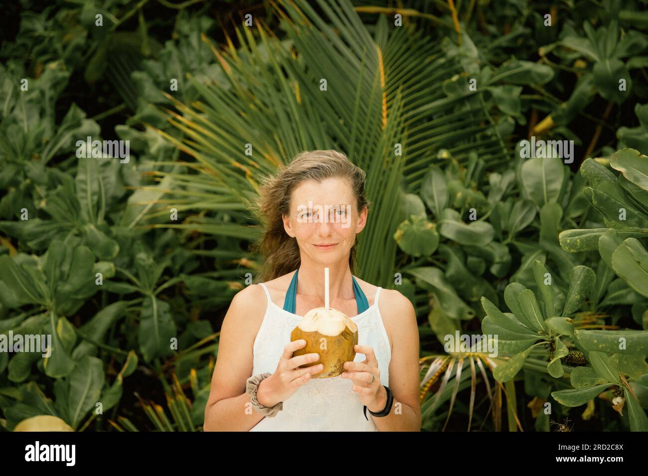 woman portrait and lush tropical greenery Stock Photo - Alamy