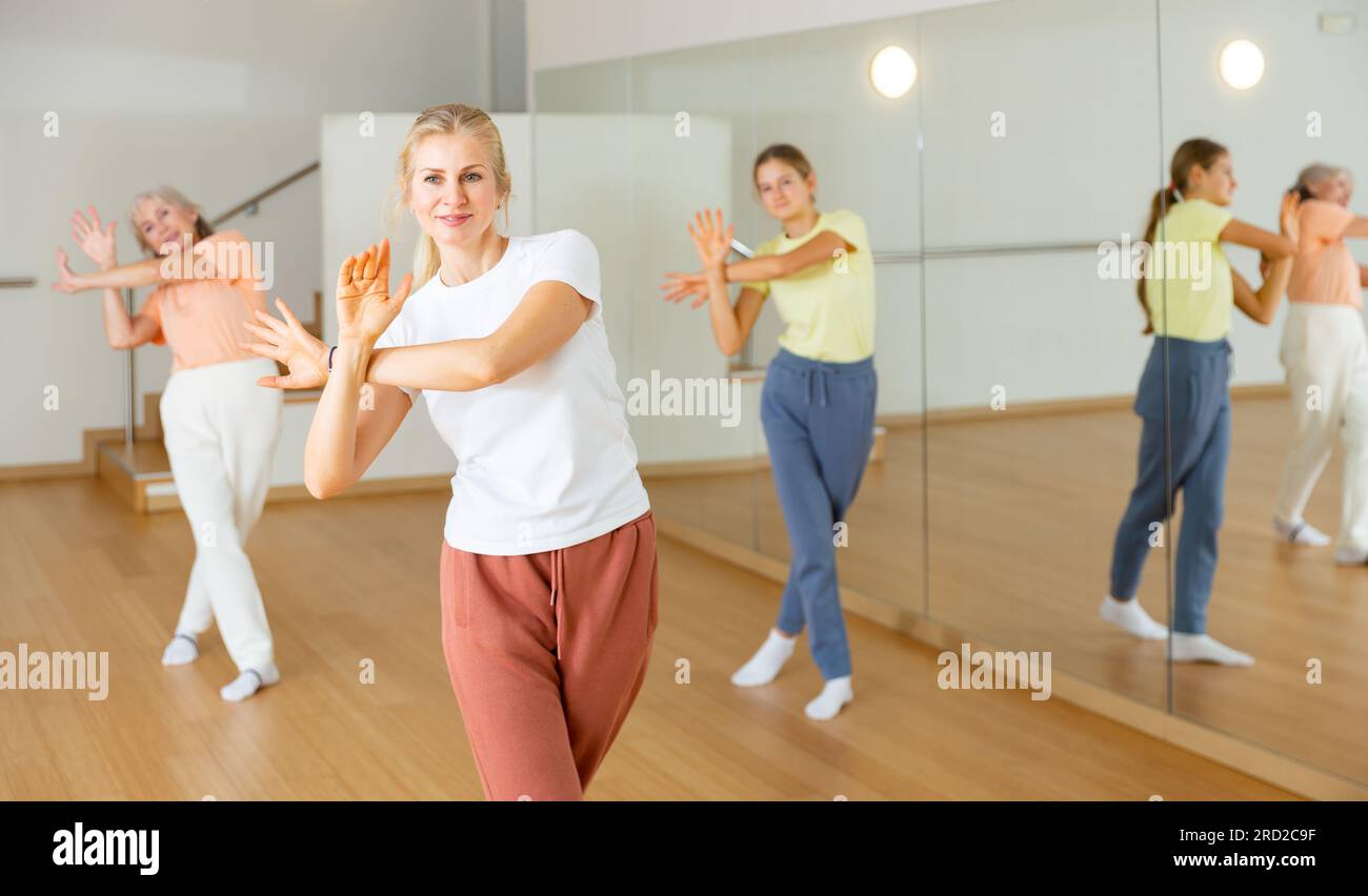 Women enjoying active dances in modern dance studio Stock Photo - Alamy