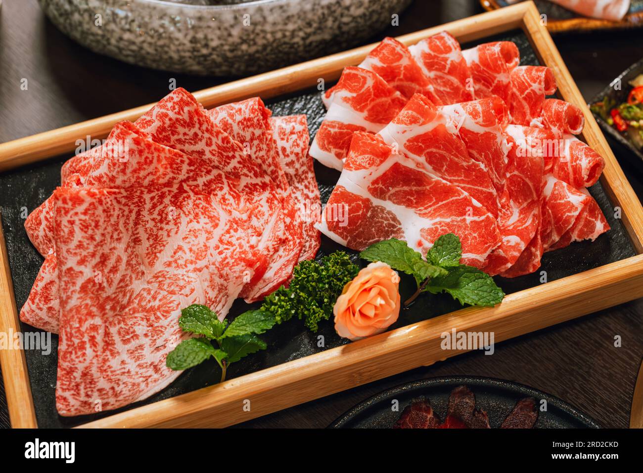 Premium Rare Slices pork with high-marbled texture on circle wooden ...