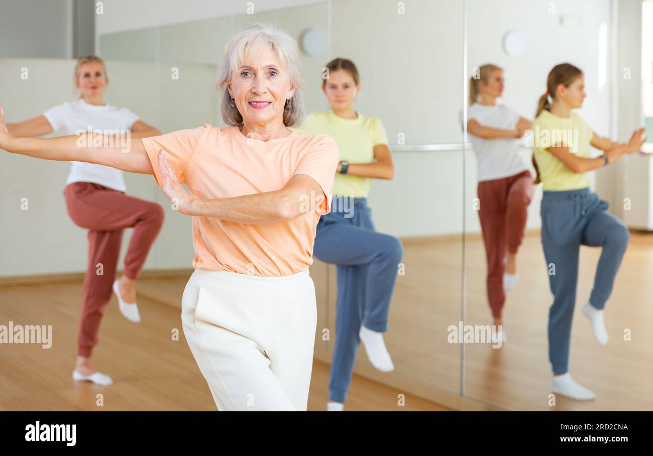 Senior woman performing contemporary dance in studio Stock Photo - Alamy