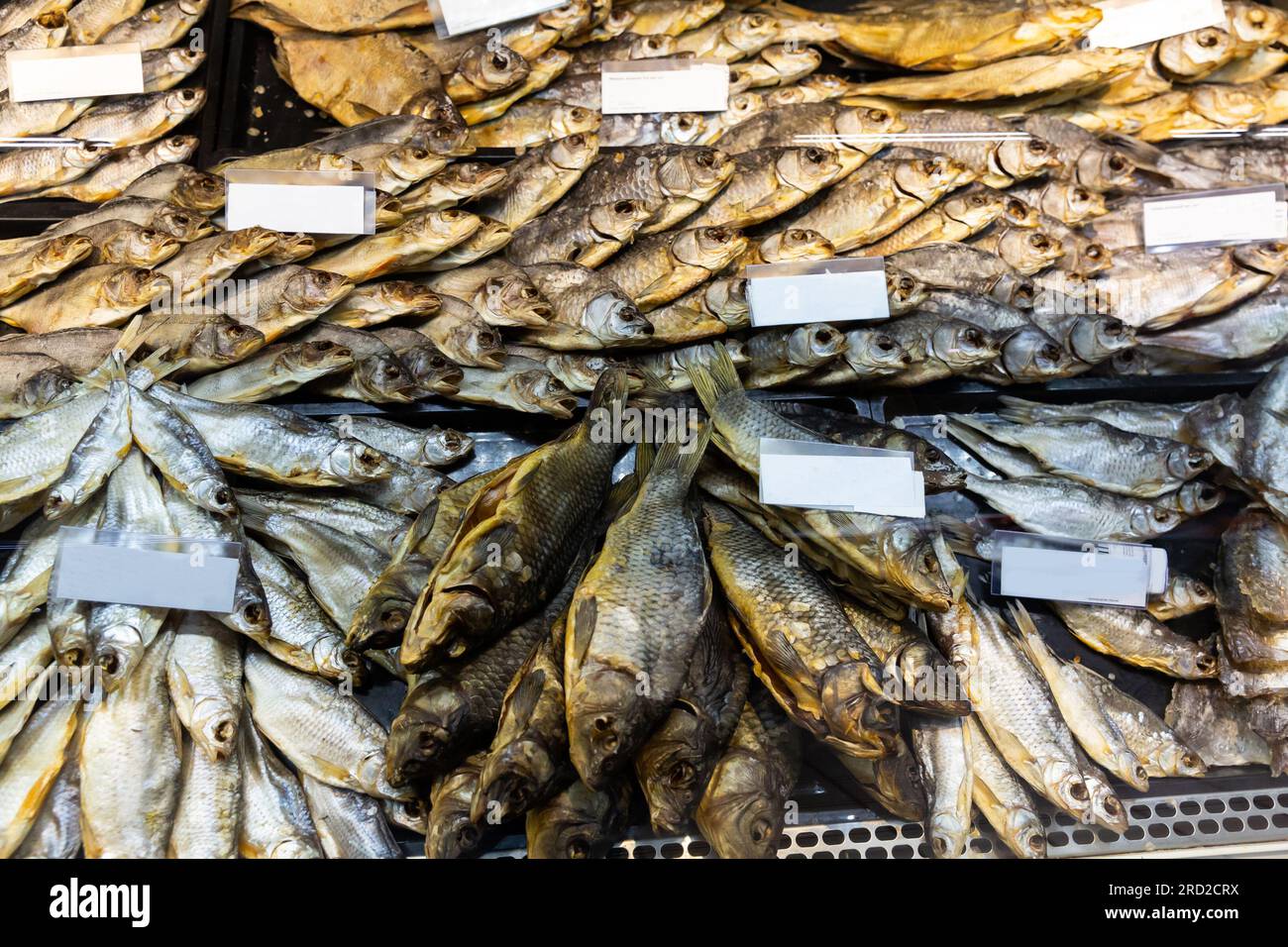 Dried salted fish on store counter Stock Photo - Alamy