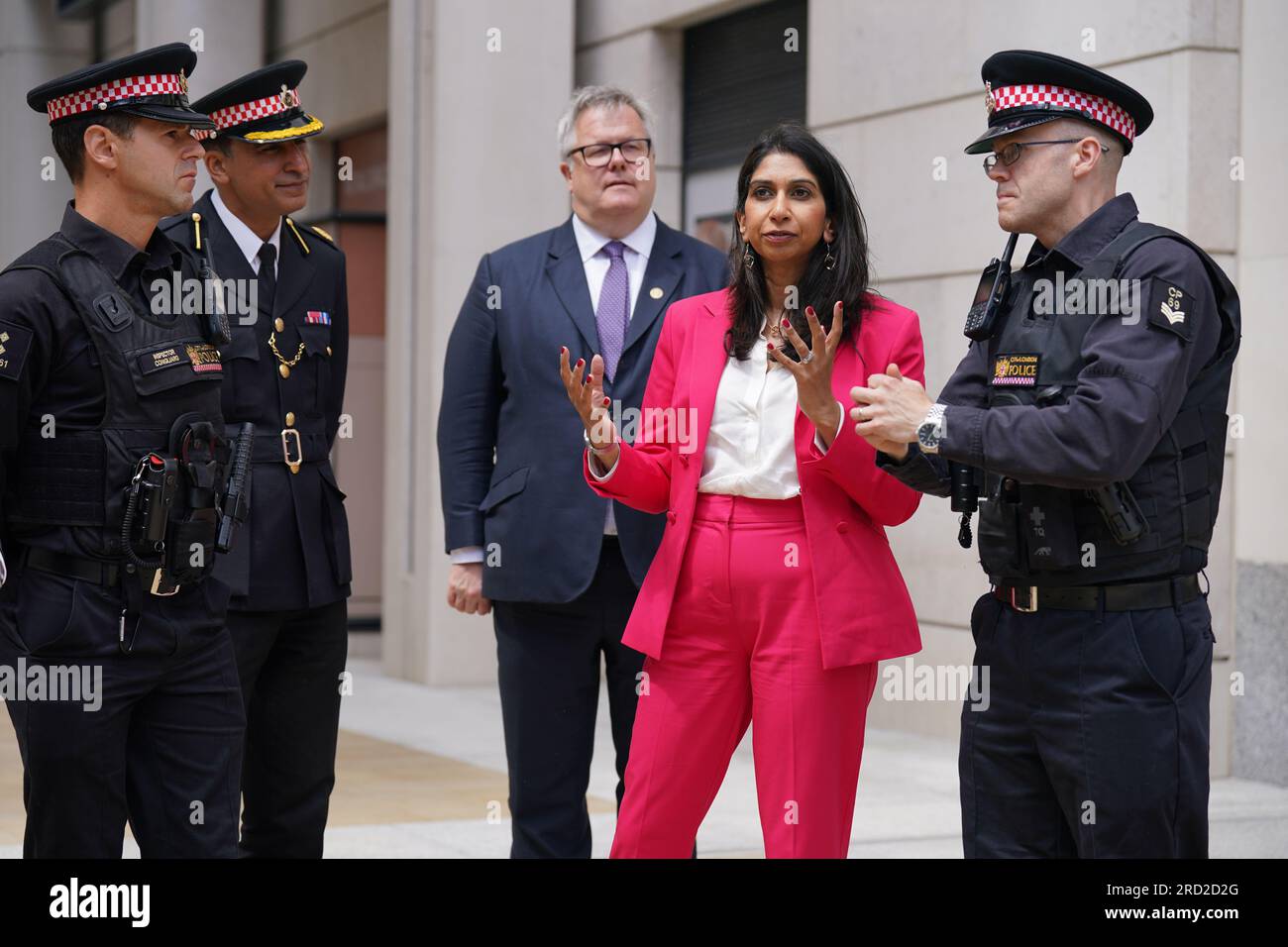 Home Secretary Suella Braverman speaks with Detective Chief Inspector ...