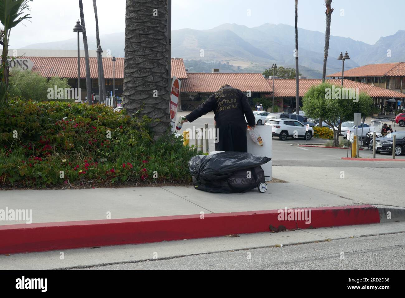 Malibu, California, USA 16th July 2023 Homeless man on Pacific Coast ...