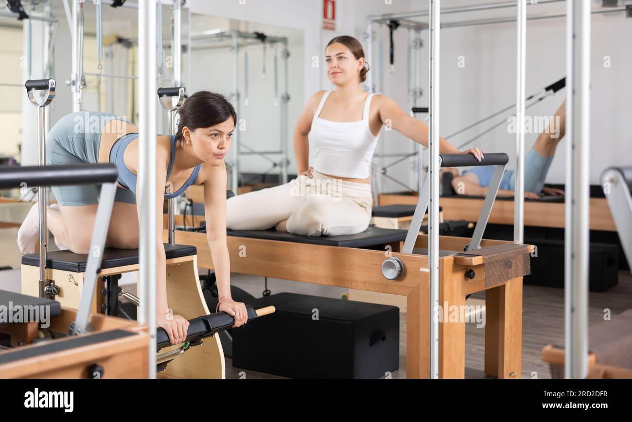Young asian woman practicing pilates on wunda chair Stock Photo - Alamy
