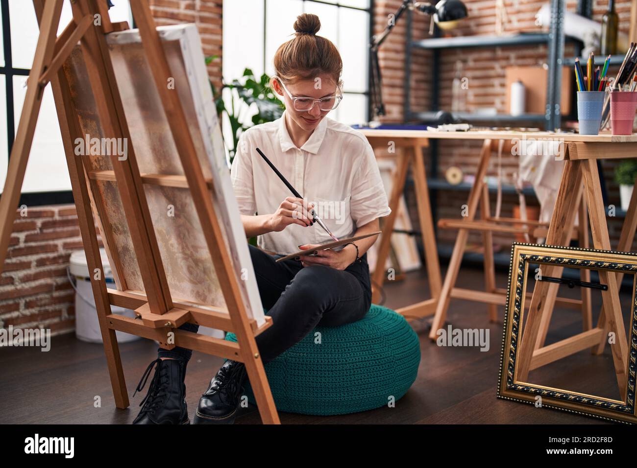 Young blonde woman artist smiling confident drawing at art studio Stock ...