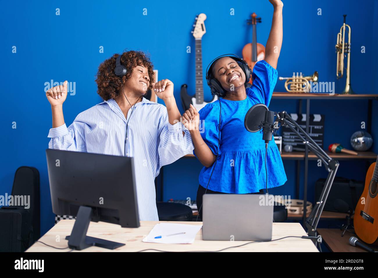 Two women singing song dancing hi-res stock photography and images - Alamy