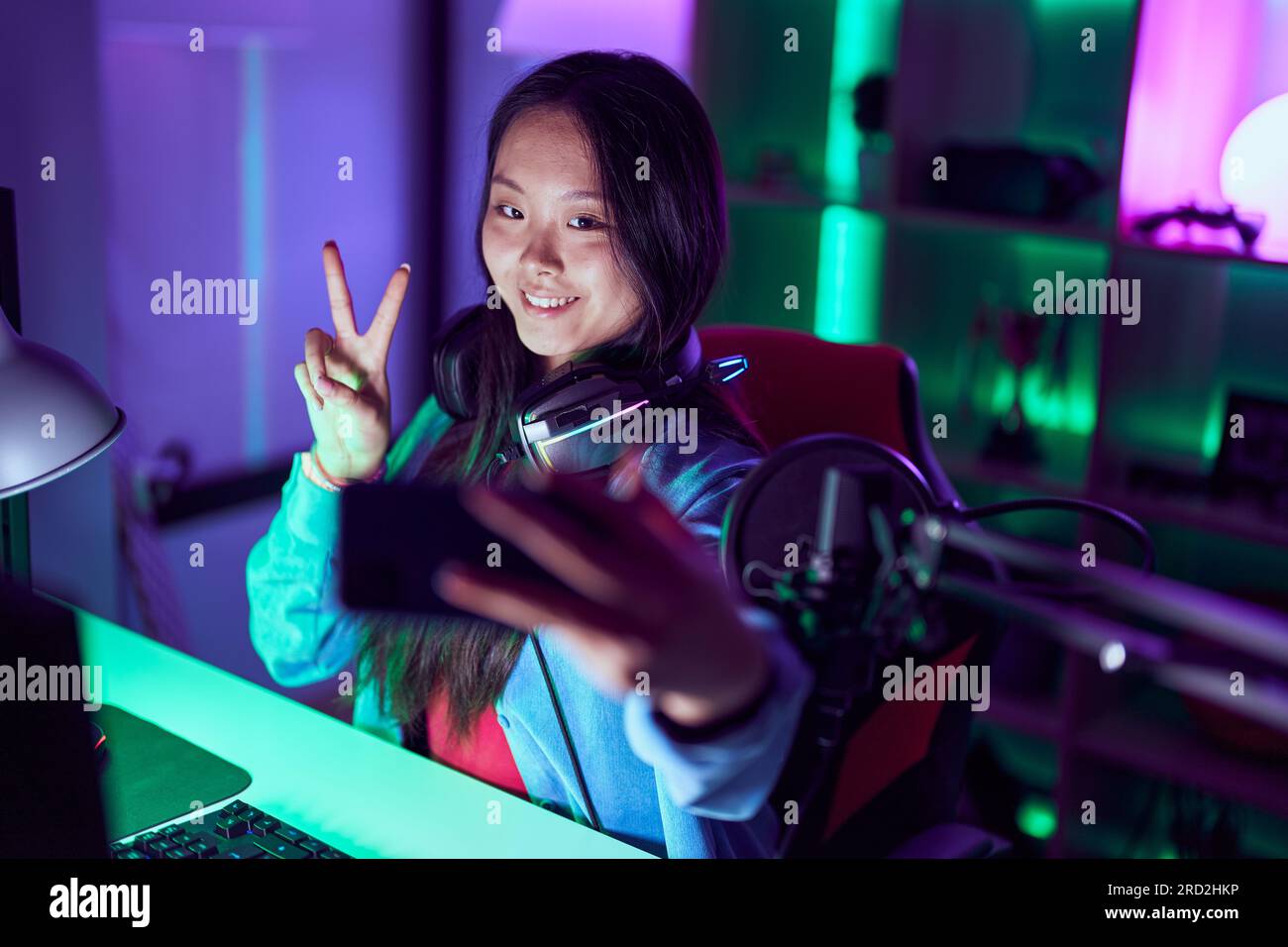 Young chinese woman streamer smiling confident make selfie by ...