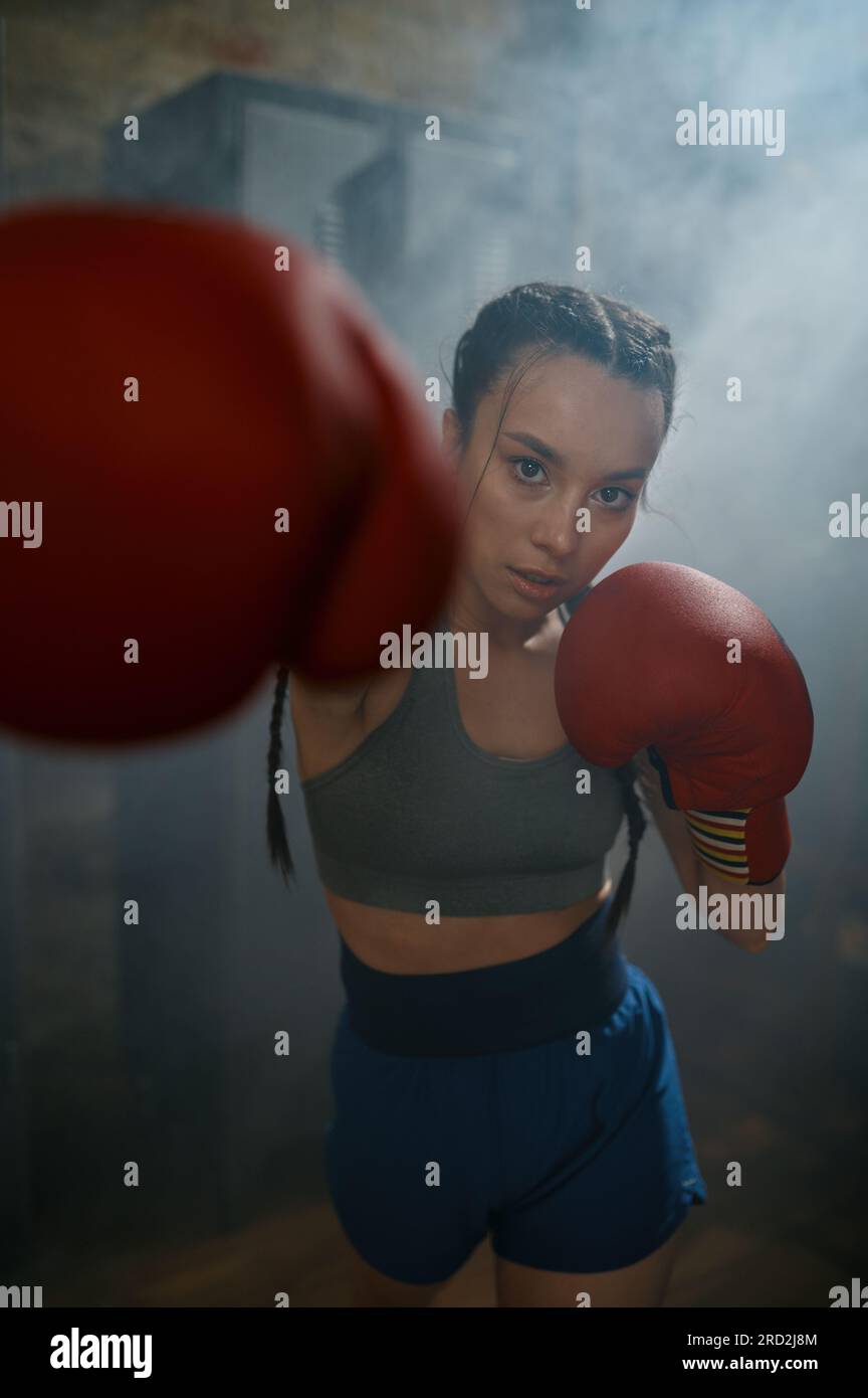 Front view portrait of powerful woman boxer fighting to camera Stock ...
