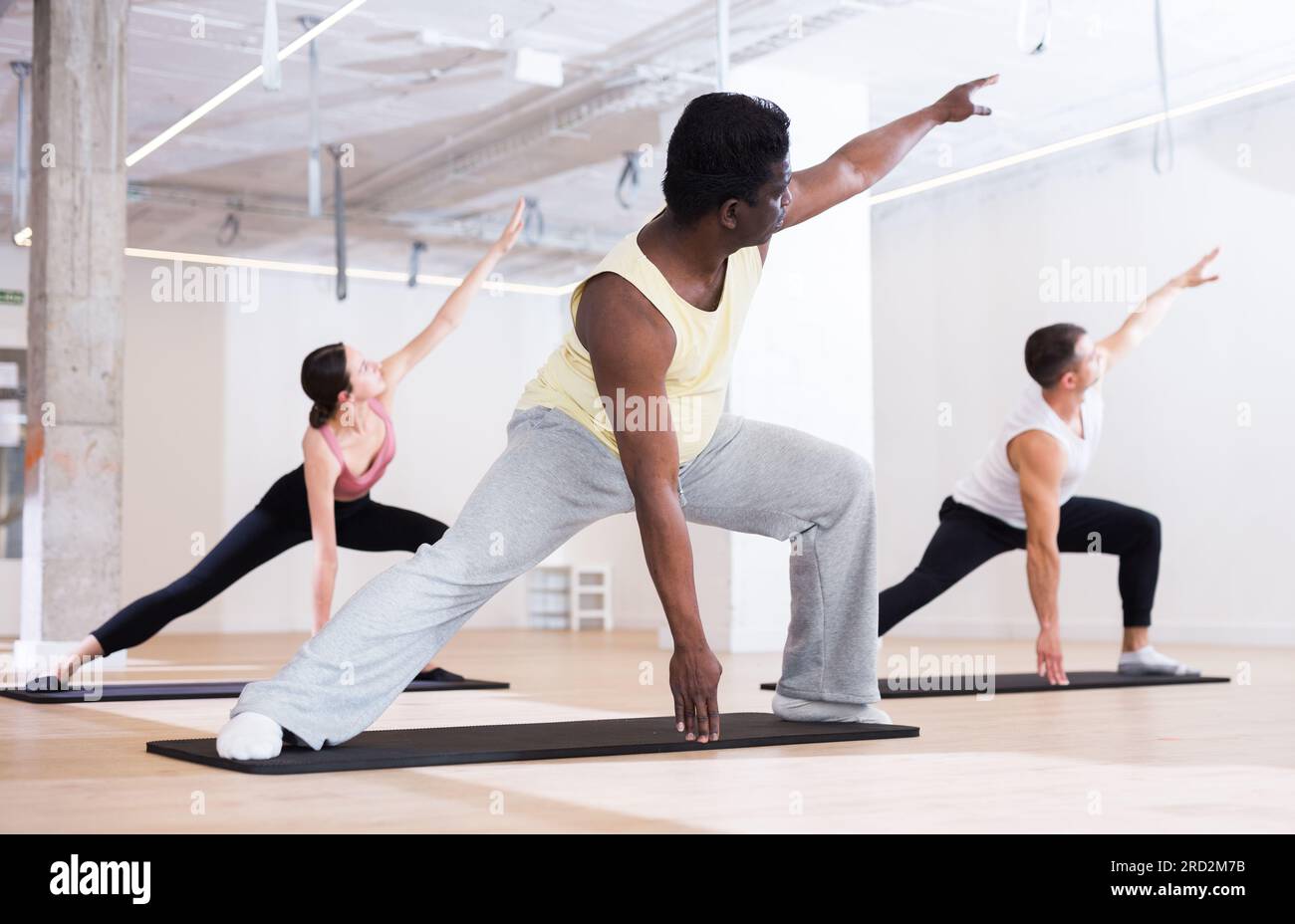 African American exercising during group pilates class Stock Photo - Alamy