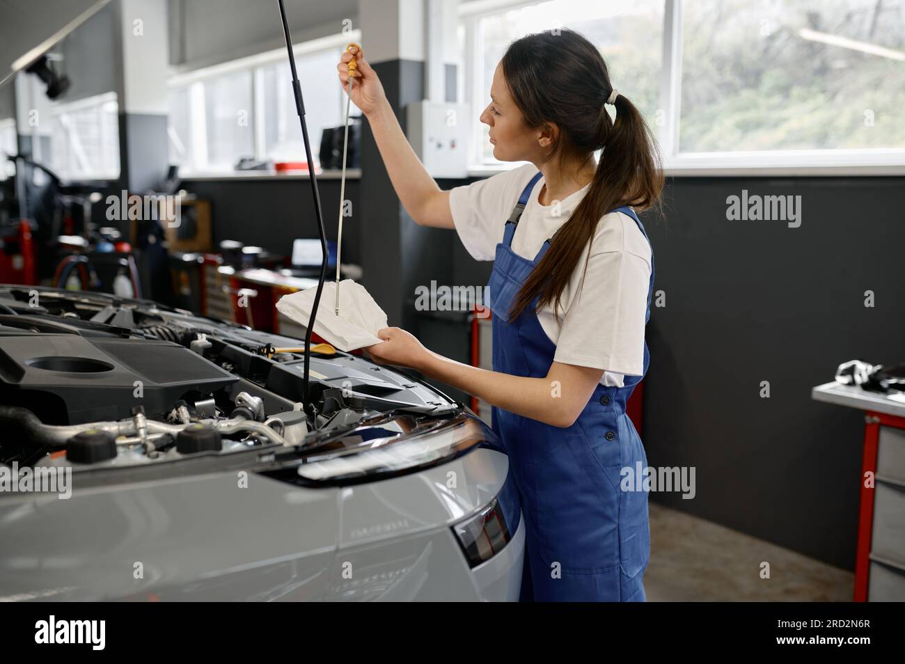 Technician checking motor oil hi-res stock photography and images - Alamy