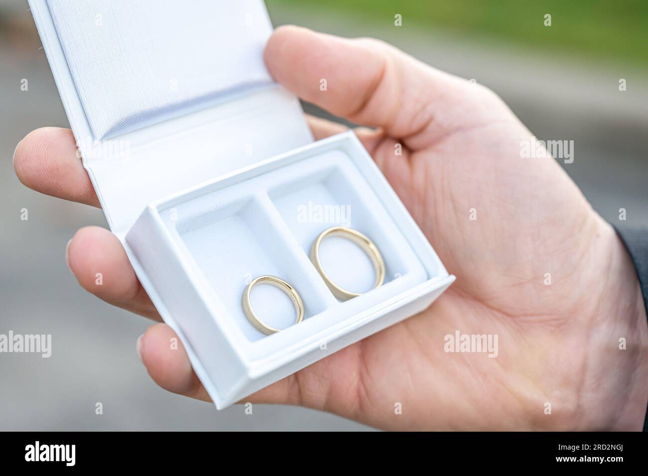 Groom hold in hand Romantic marriage couple wedding Symbols rings in a ...