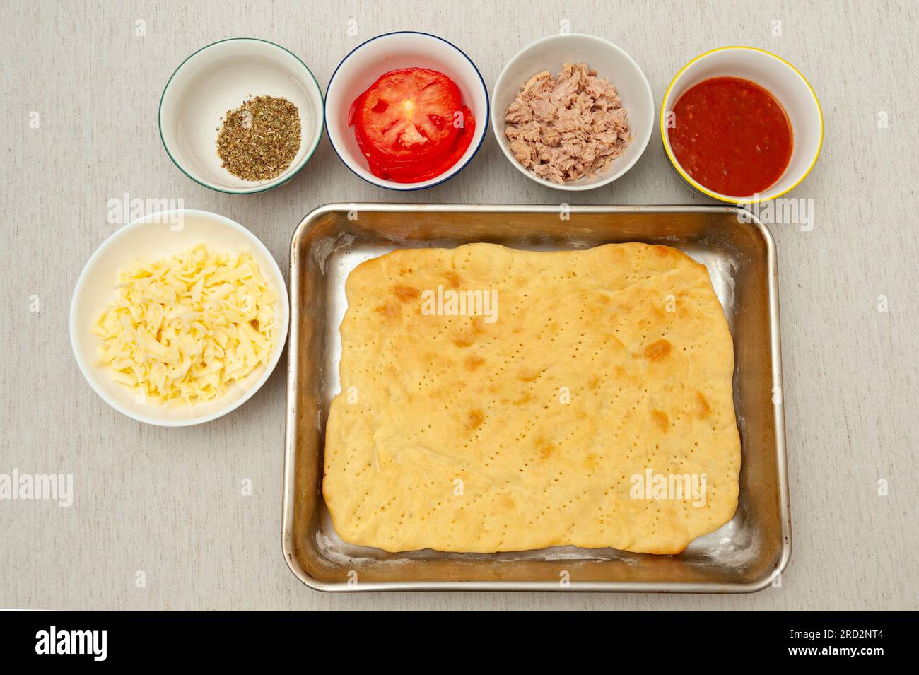 Making Homemade Rectangular Pizza - Ingredients in top view: Cheese ...