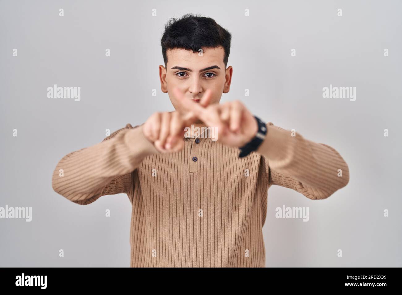 Non binary person standing over isolated background rejection ...