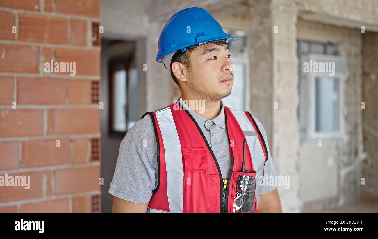 builder standing with serious expression at construction site Stock ...