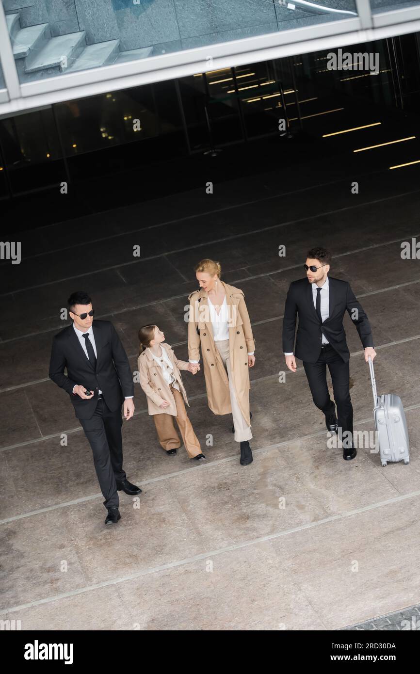 private security, top view of personal bodyguards protecting female ...