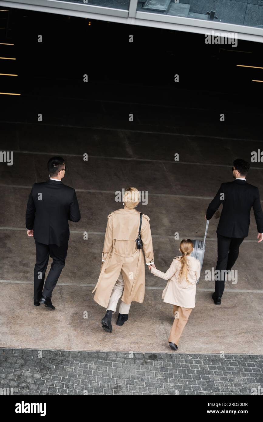 Security guards protecting girl hi-res stock photography and images - Alamy