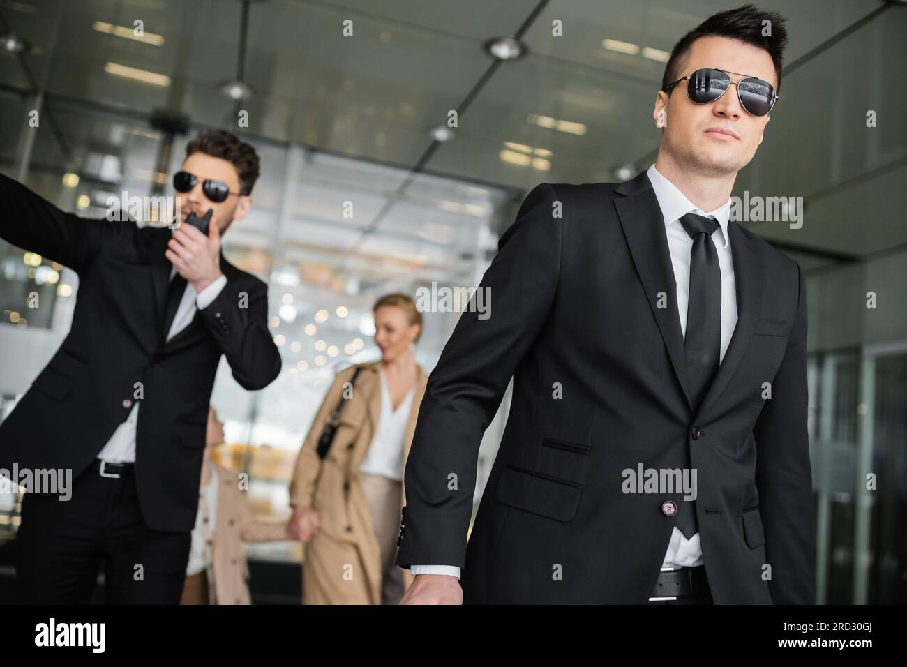 bodyguards protecting privacy of female clients, mother and daughter ...