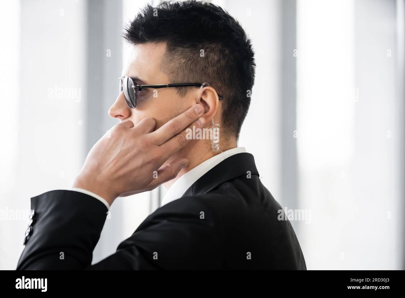 professional headshots, bodyguard communicating through earpiece, man ...