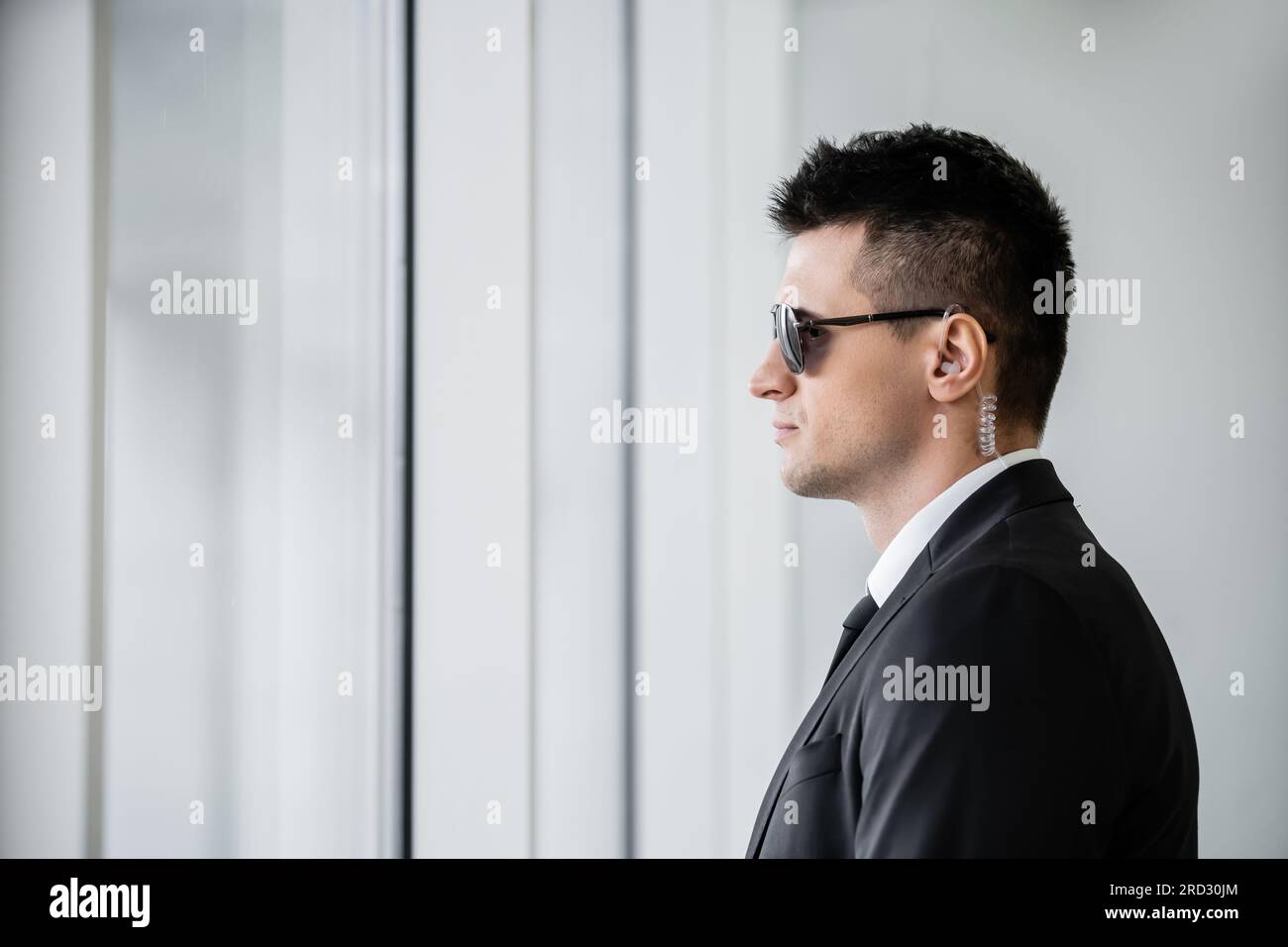 professional headshots, bodyguard service, side view of handsome man in ...