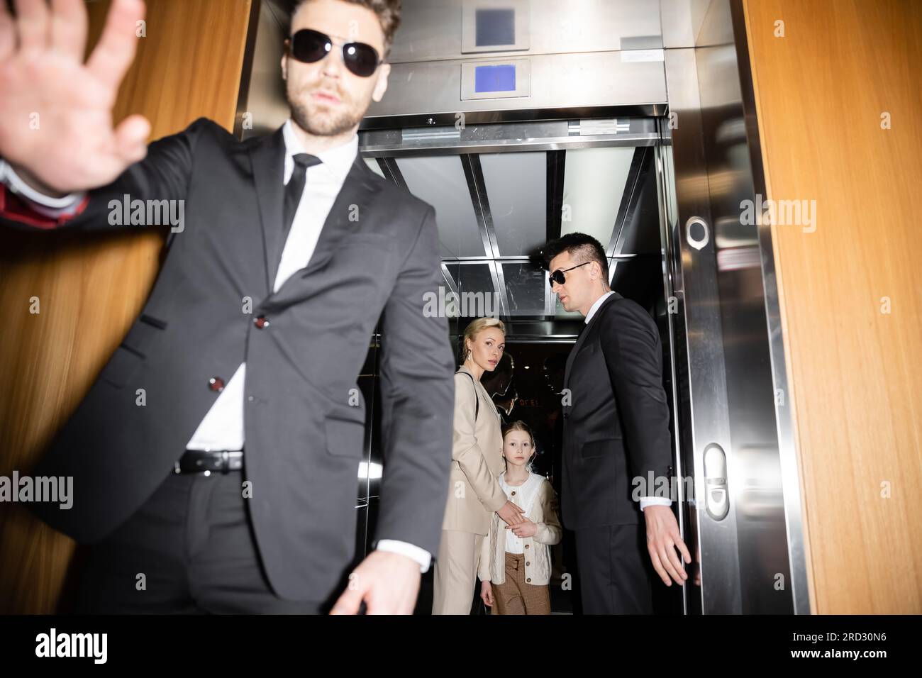 private security concept, handsome bodyguard in sunglasses and suit ...