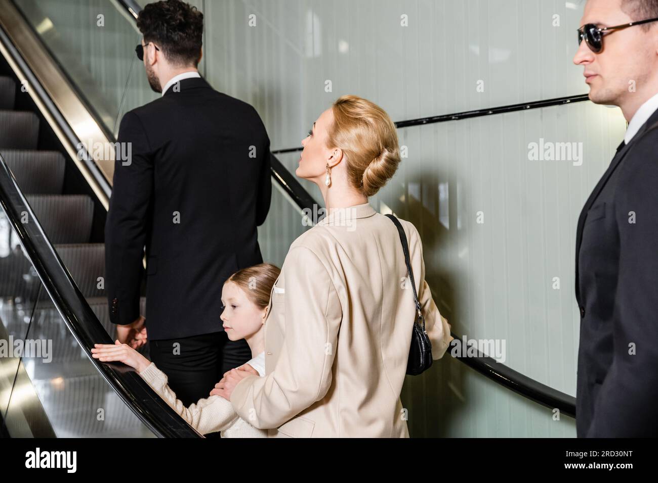 personal safety, blonde and successful woman and preteen girl standing ...