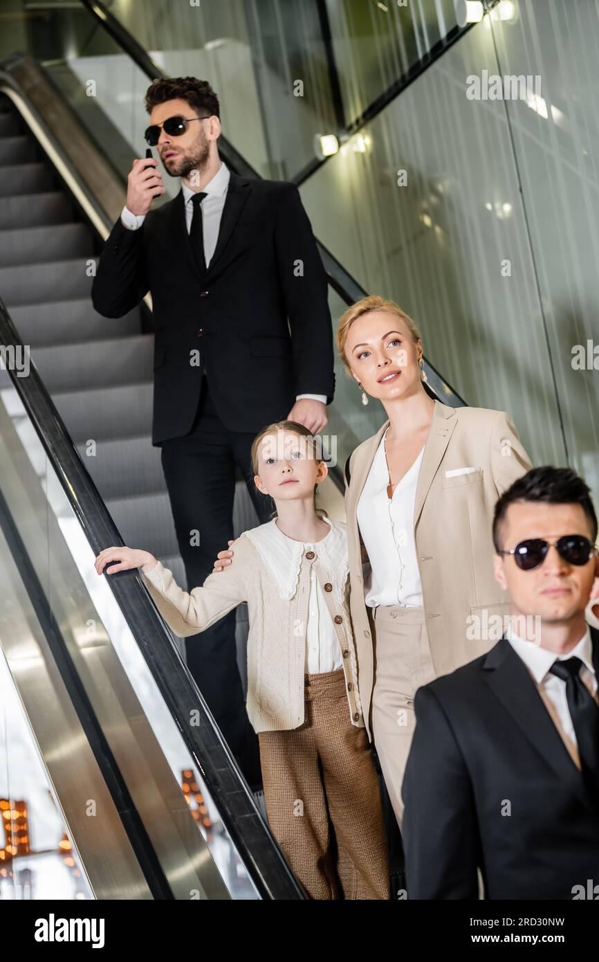 personal security concept, successful woman and her preteen daughter ...