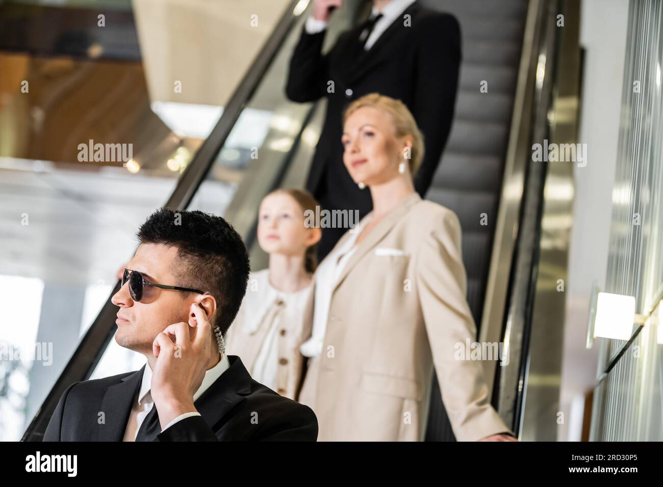 Security guards protecting girl hi-res stock photography and images - Alamy