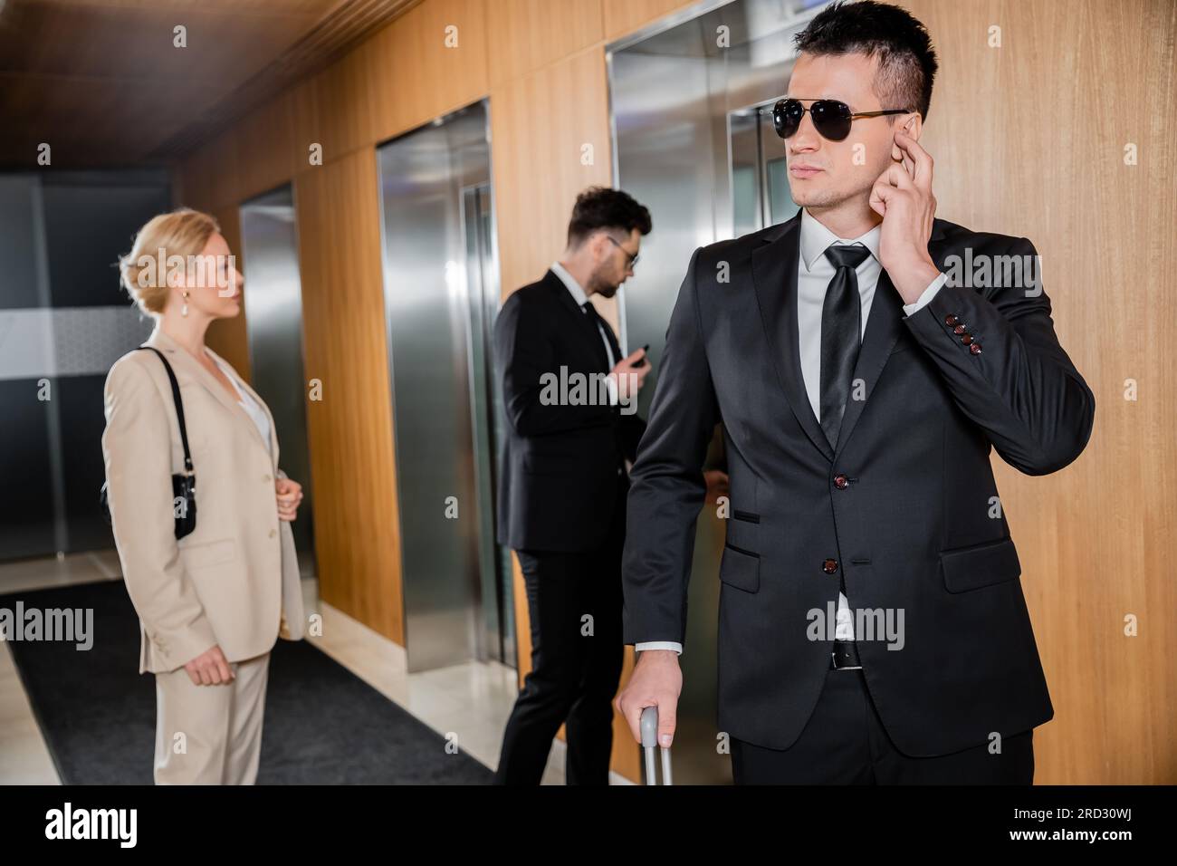 bodyguard service, personal protection, blonde woman in formal wear ...