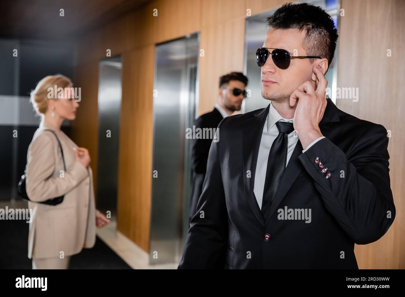 bodyguard service, personal protection, blonde woman in formal wear ...