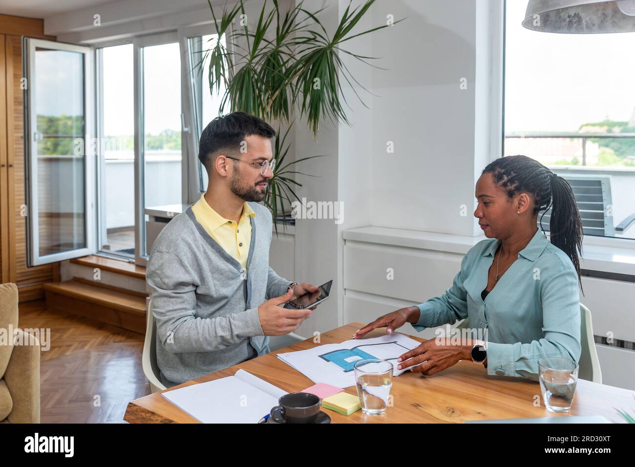 Portrait of success business people working together in home office ...