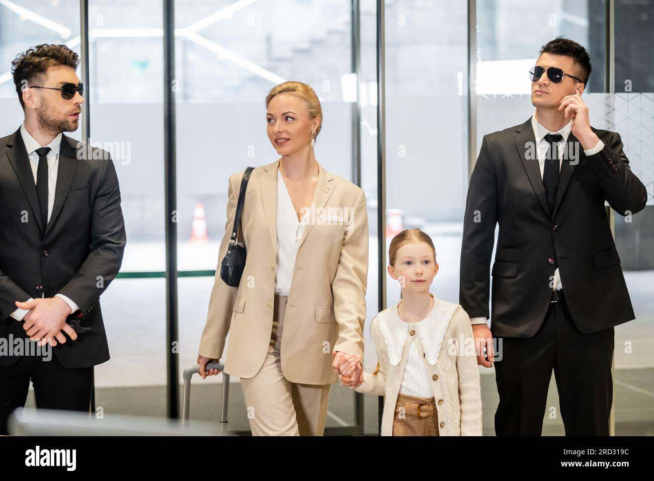 personal security concept, two bodyguards in suits and sunglasses ...