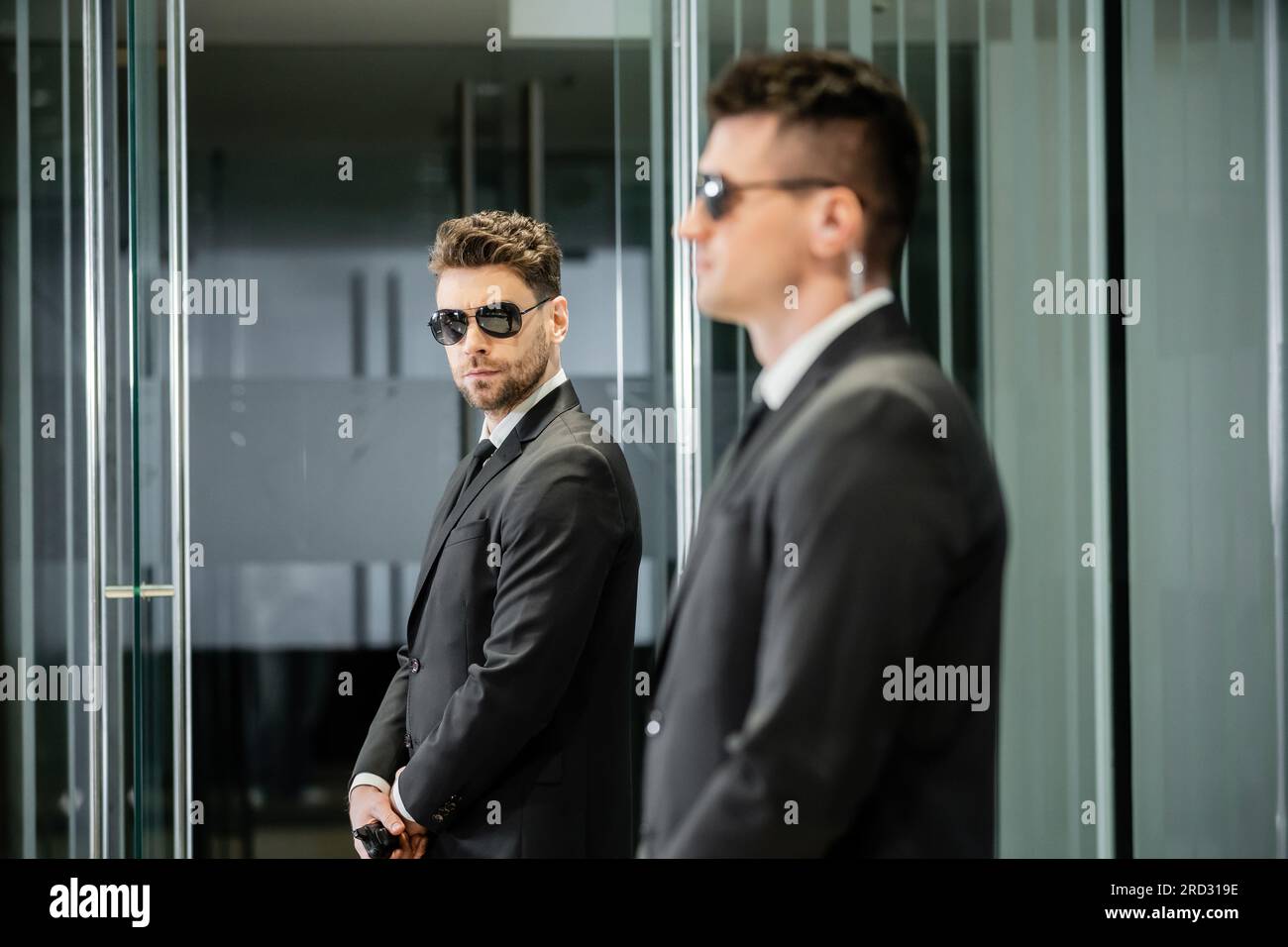 bodyguard service, hotel security, handsome man in suit and sunglasses ...