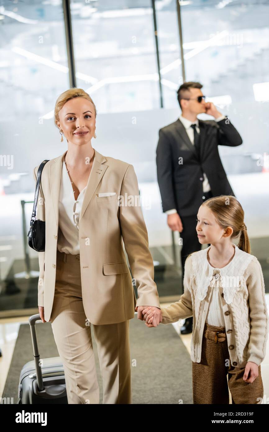 luxury lifestyle, rich life, personal security, cheerful woman with ...