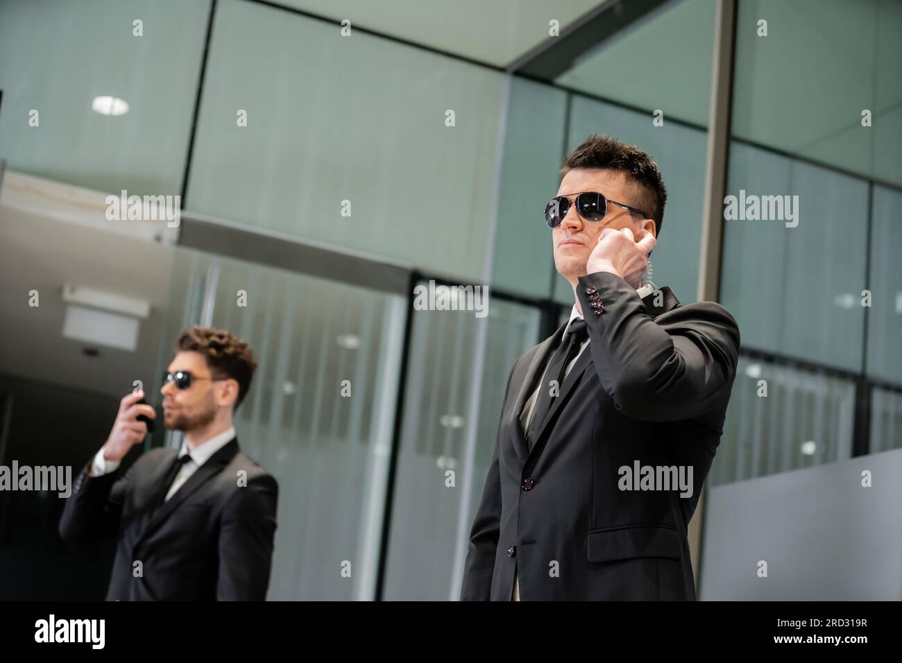 hotel security concept, professional guards in suits and sunglasses ...