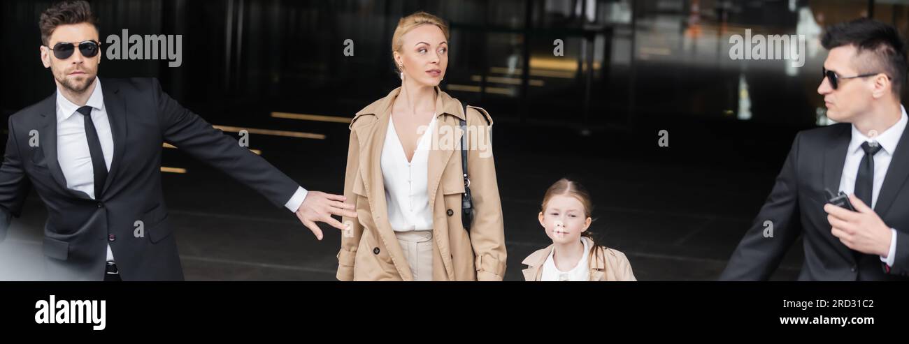 Security guards protecting girl hi-res stock photography and images - Alamy