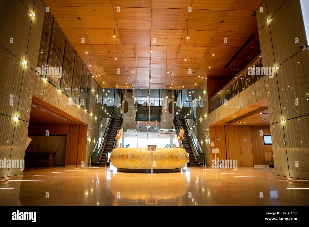 modern hotel interior with round reception desk and sophisticated lobby ...