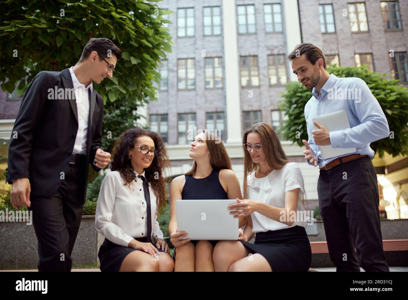 Group of employees, business people, project leaders sitting on bench ...