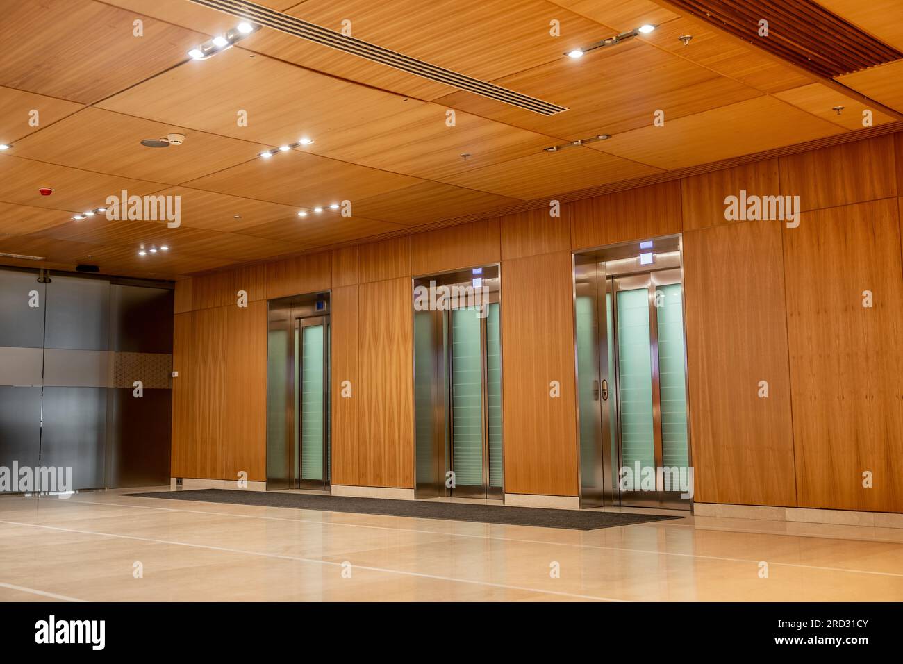 modern hotel interior with sophisticated lobby design, elevators ...