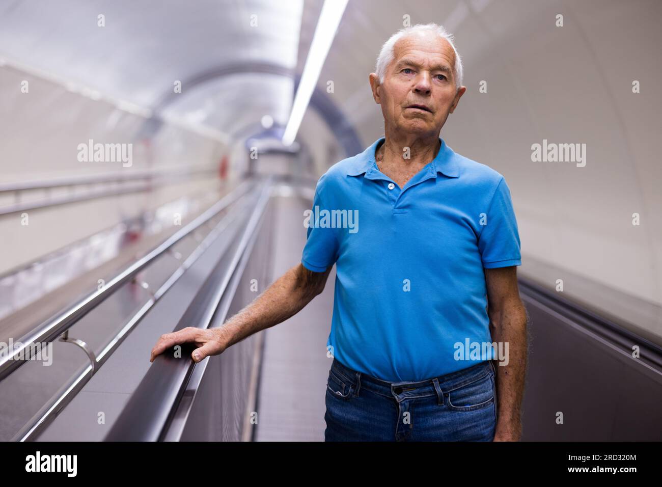 Retired man walking down the escalator to metro station Stock Photo - Alamy
